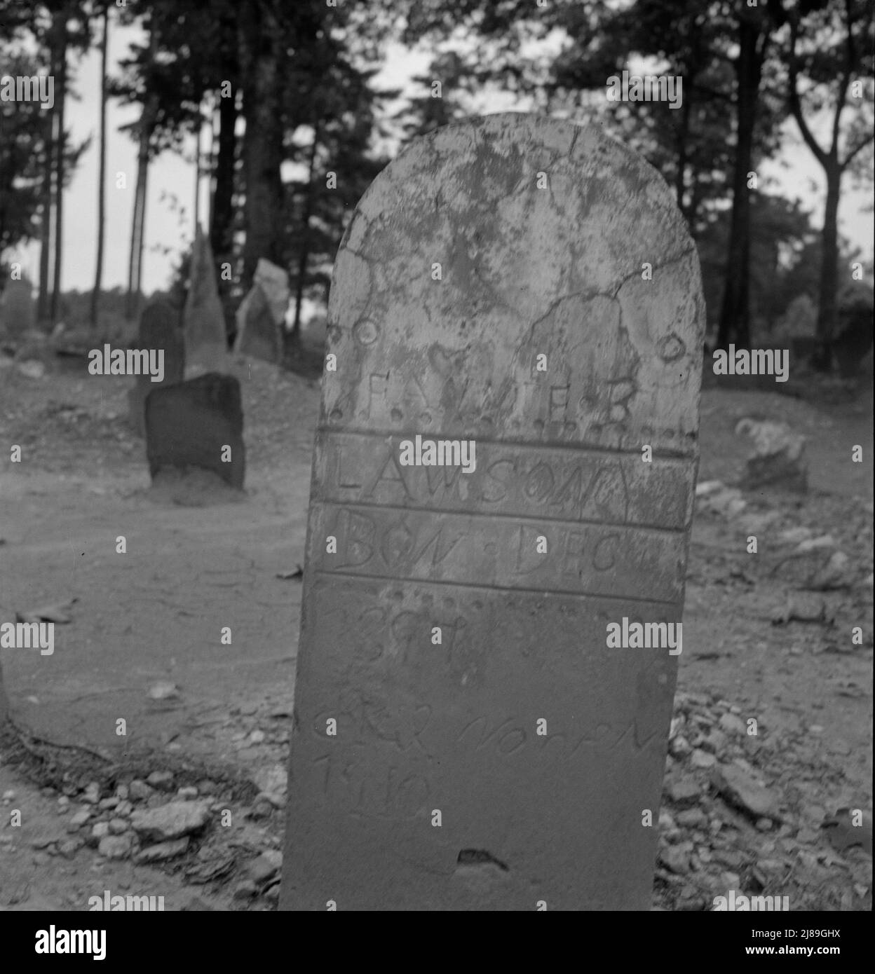Tombstone in a red clay Negro cemetery. Person County, North Carolina ...