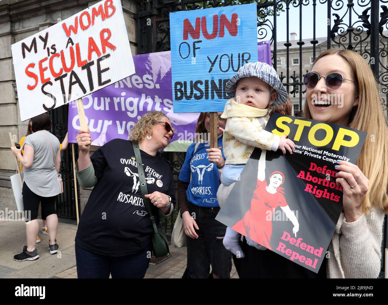 Donnacha Moon-Hannon (6) and Aileen Moon (right) take part in a protest ...
