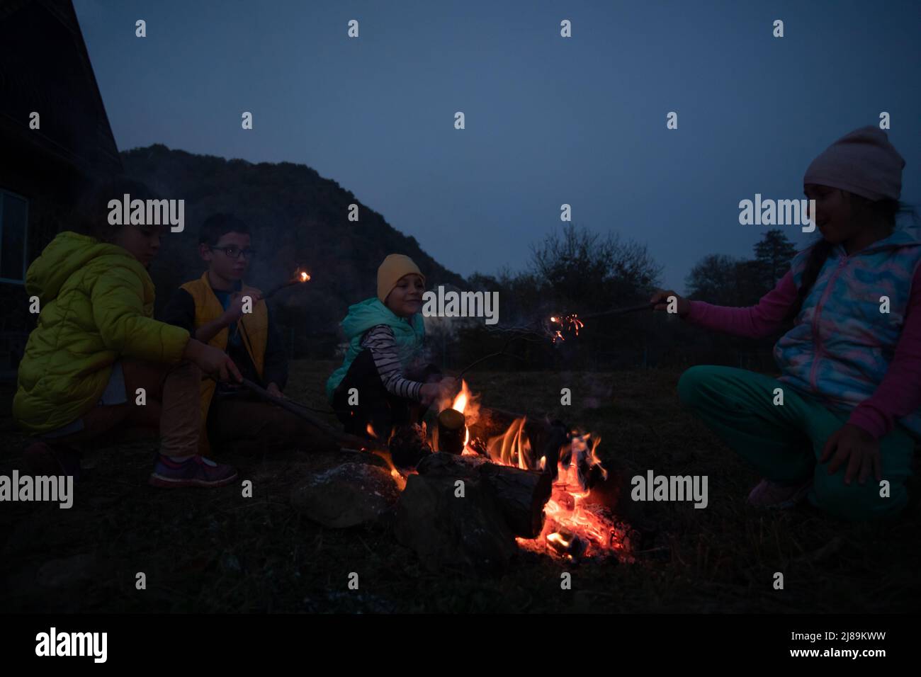 Children in the camp by the fire Stock Photo - Alamy