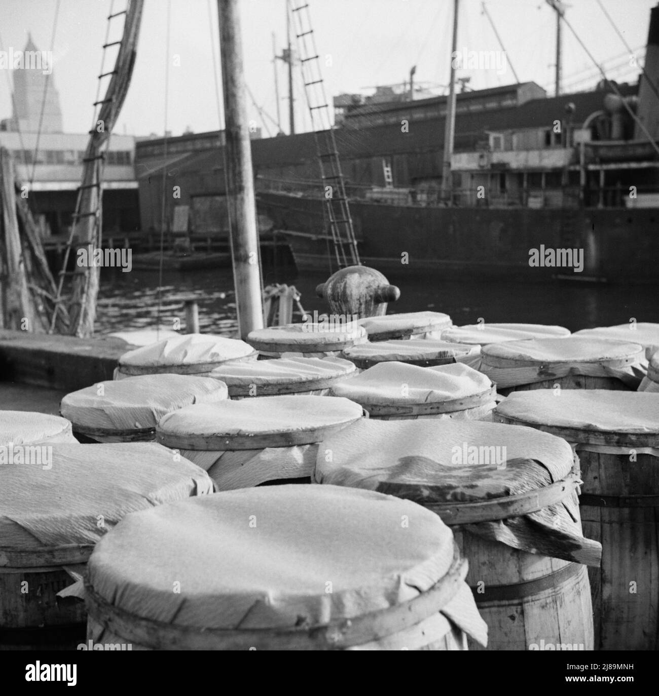 New York, New York. Barrels of fish on the docks at the Fulton fish ...