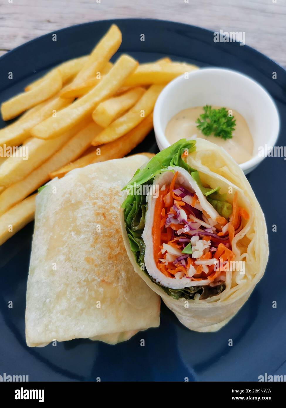 fried spring rolls served with French fries Stock Photo - Alamy