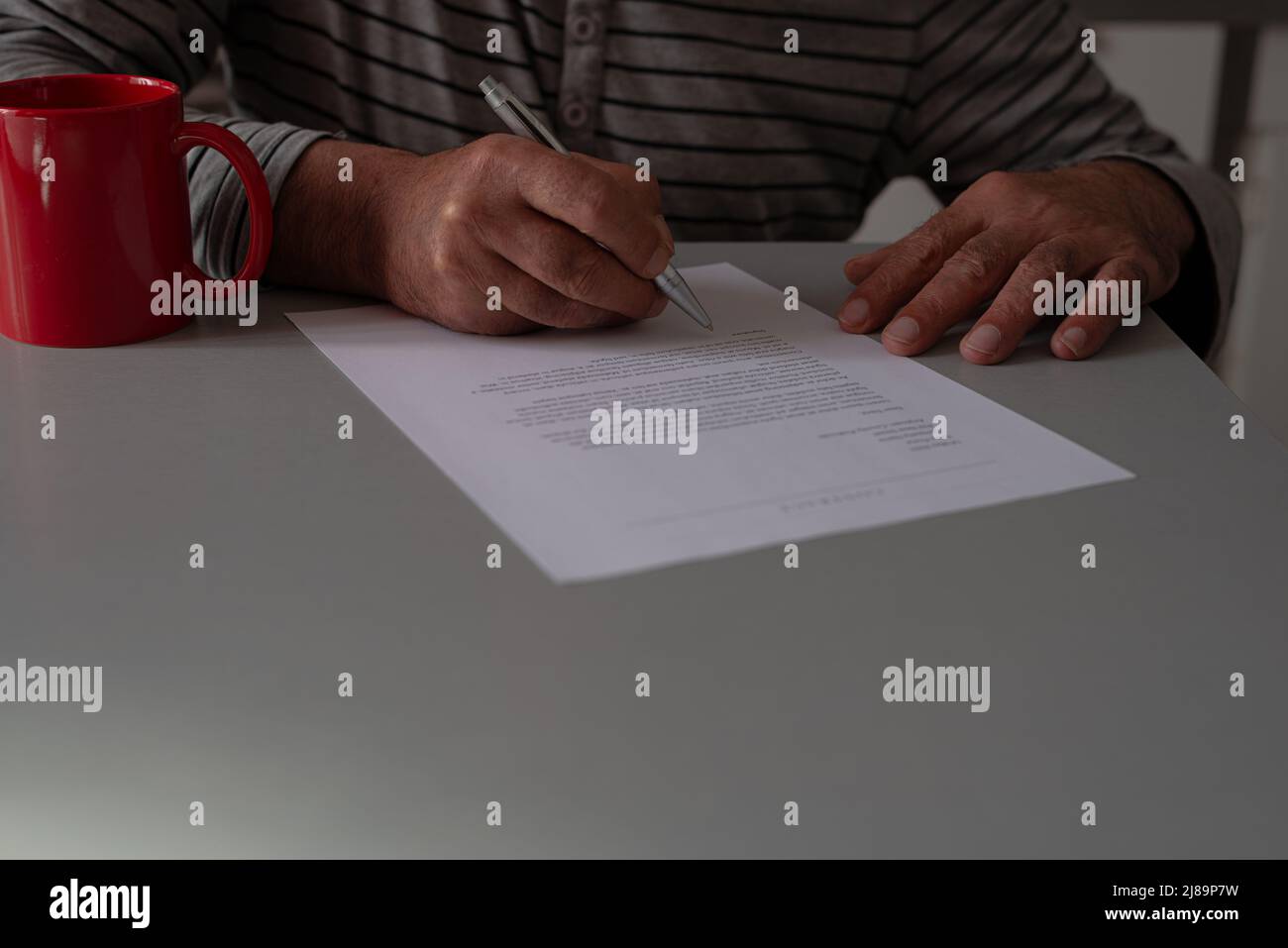 man signing papers concept of everyday life , divorce papers or for a ...