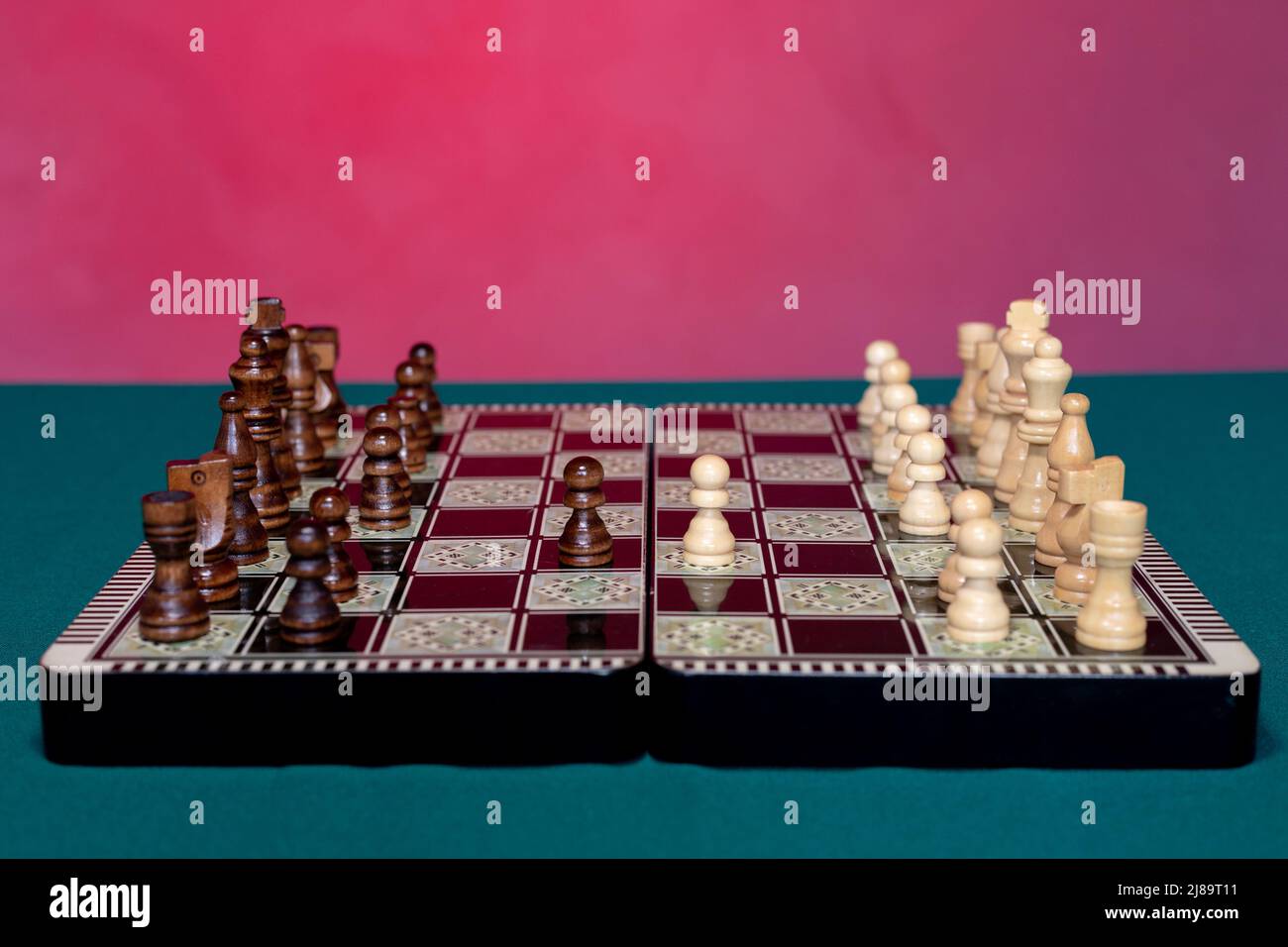 Two pawns met on a chess board Stock Photo - Alamy