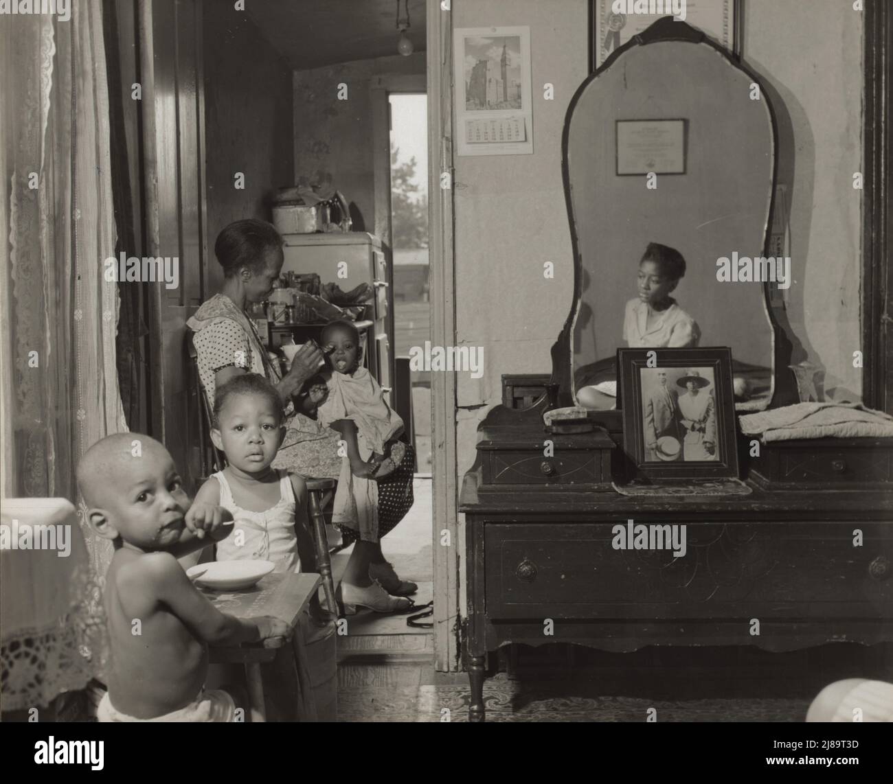 Washington, D.C. Dinner time at the home of Mrs. Ella Watson, a ...