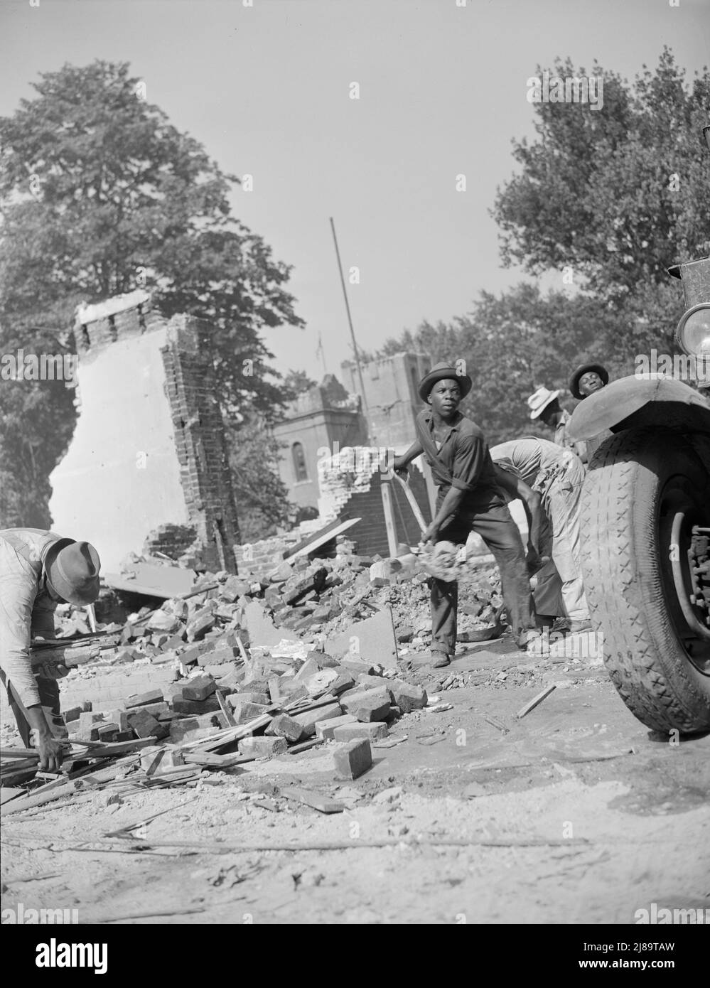 Washington, D.C. Loading debris from wrecked buildings along ...