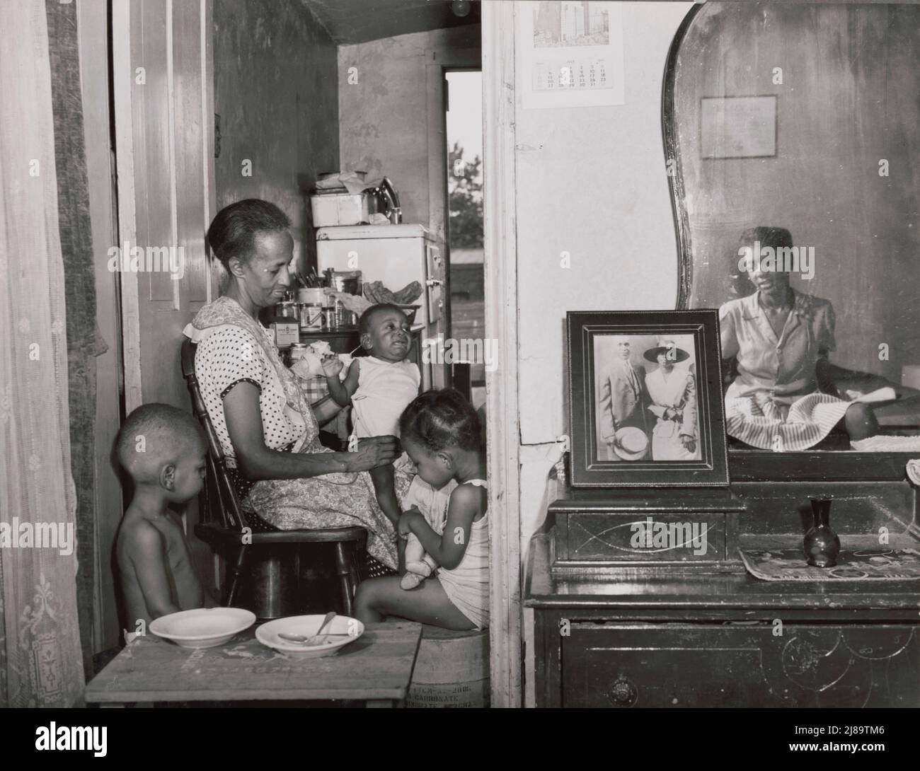 Washington, D.C. Mrs. Ella Watson, a government charwoman, with three ...
