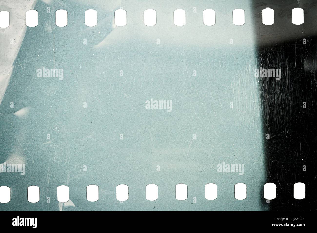 Dusty and grungy 35mm film texture or surface. Perforated scratched ...