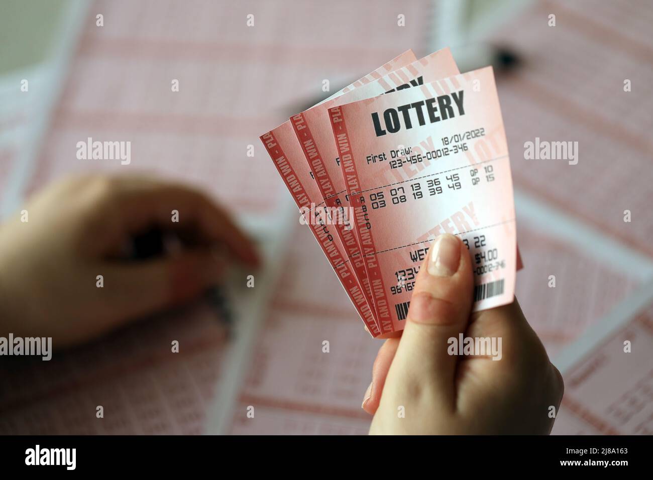 Woman with lotery ticket hi-res stock photography and images - Alamy