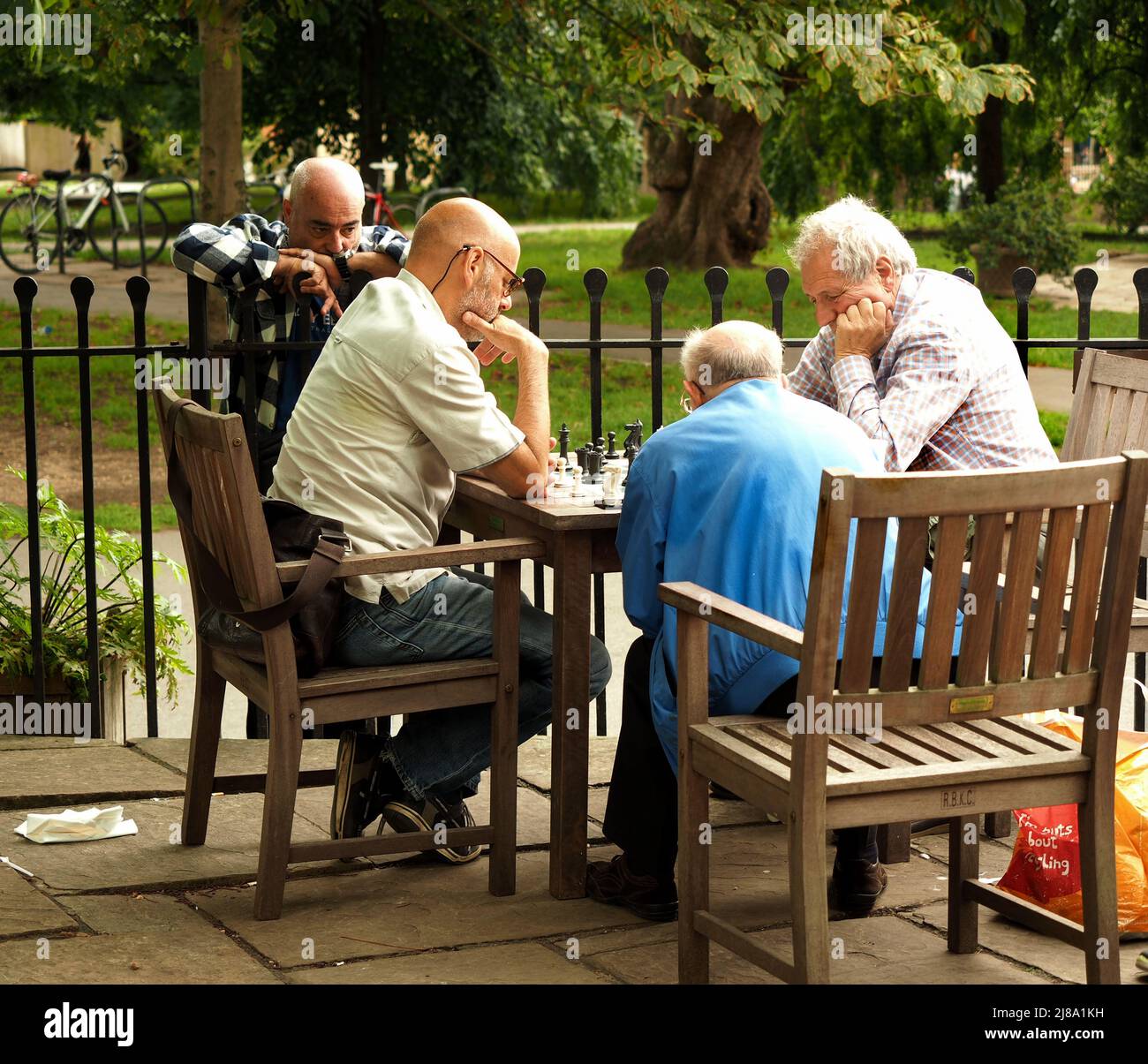 London 2017 a group of retired elderly men play chess in a london park ...