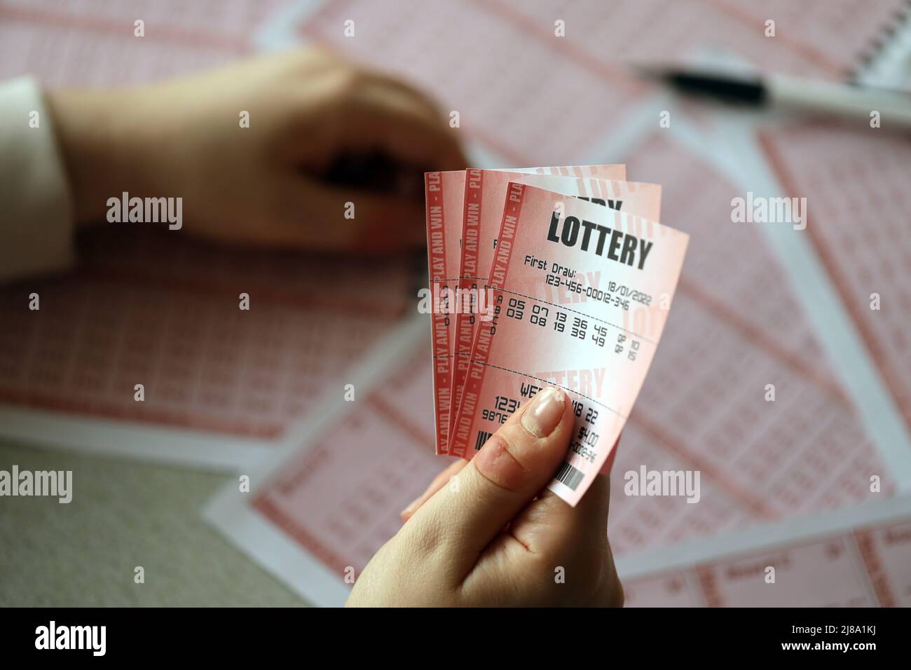 Woman with lotery ticket hi-res stock photography and images - Alamy
