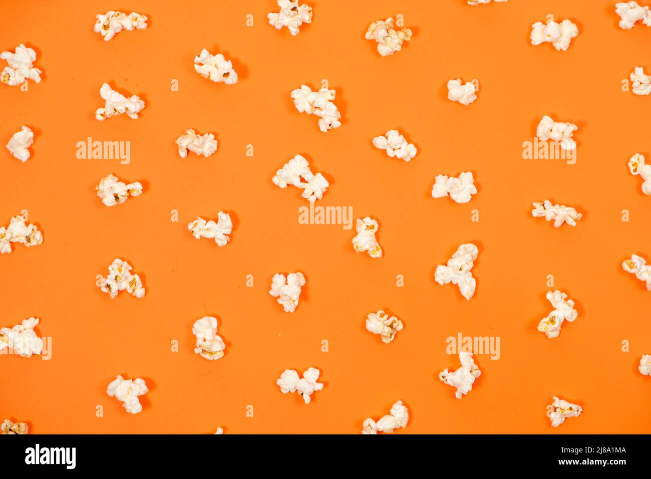 Popcorn on orange hi-res stock photography and images - Alamy