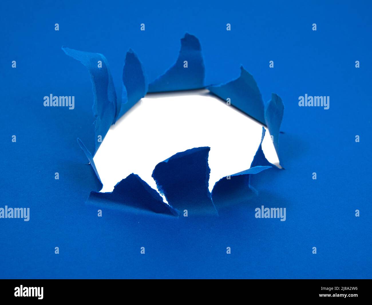 Blue crushed torn paper with hole copyspace background for idea Stock ...