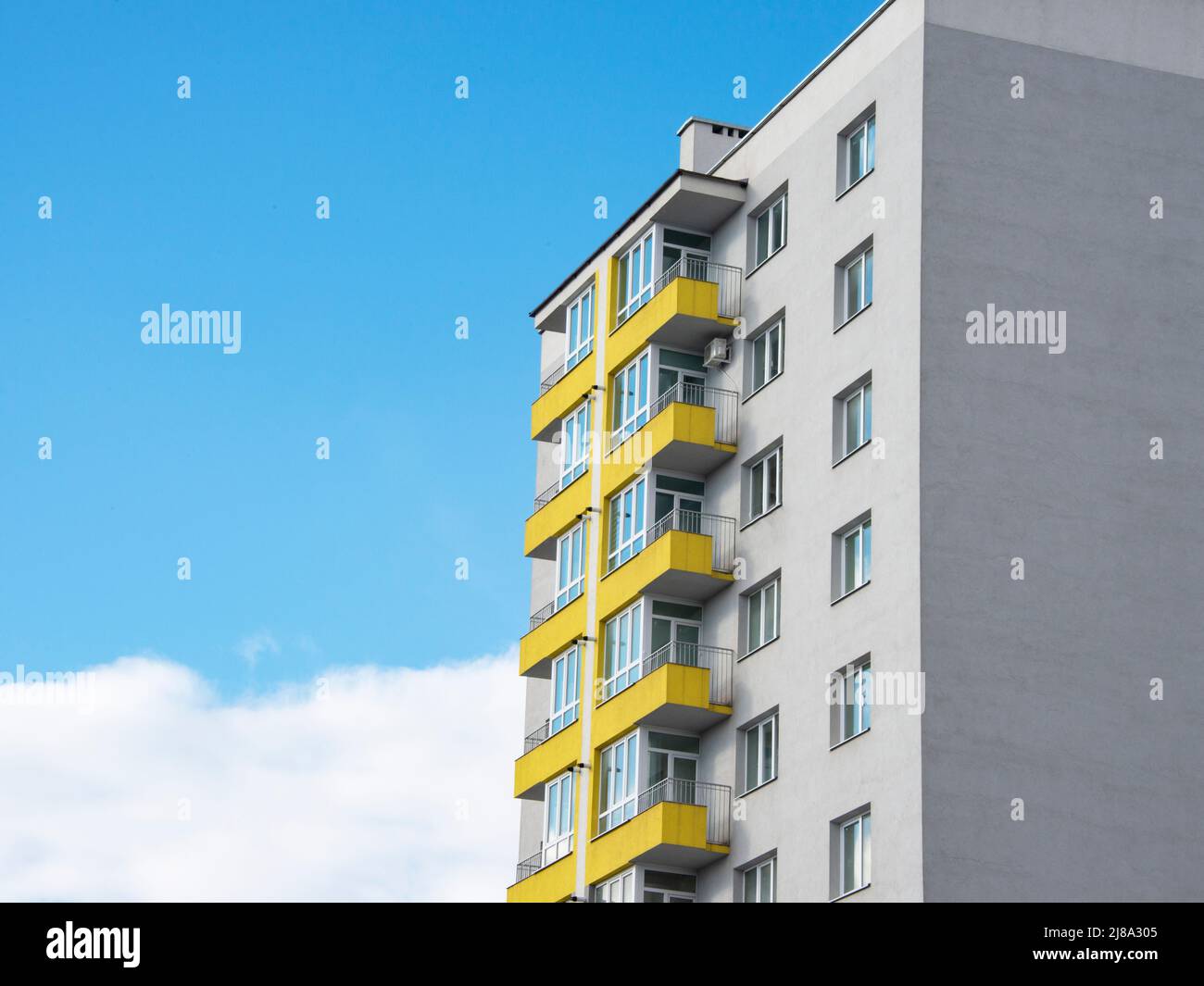 Gray yellow pantone new building house many floors and blue sky ...