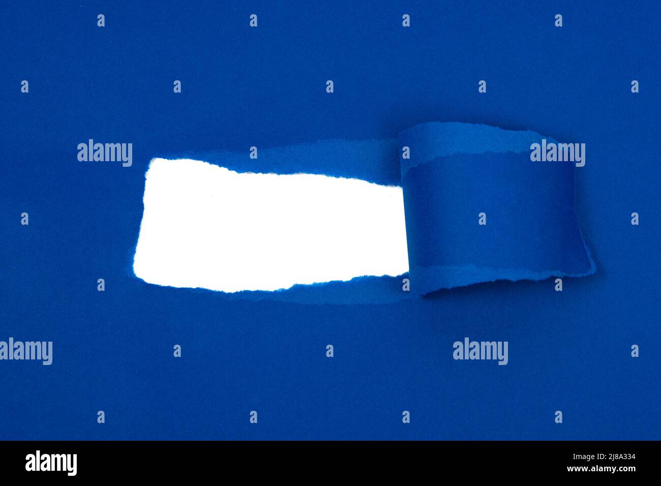 Blue crushed torn paper with hole copyspace background for idea Stock ...