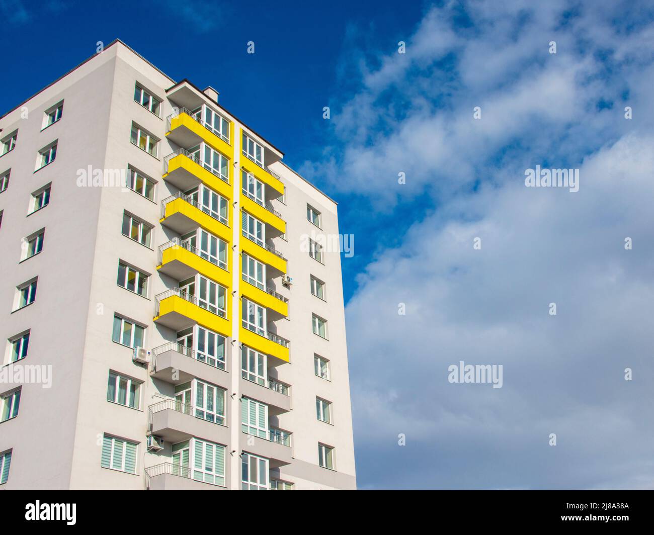 Gray yellow pantone new building house many floors and blue sky ...