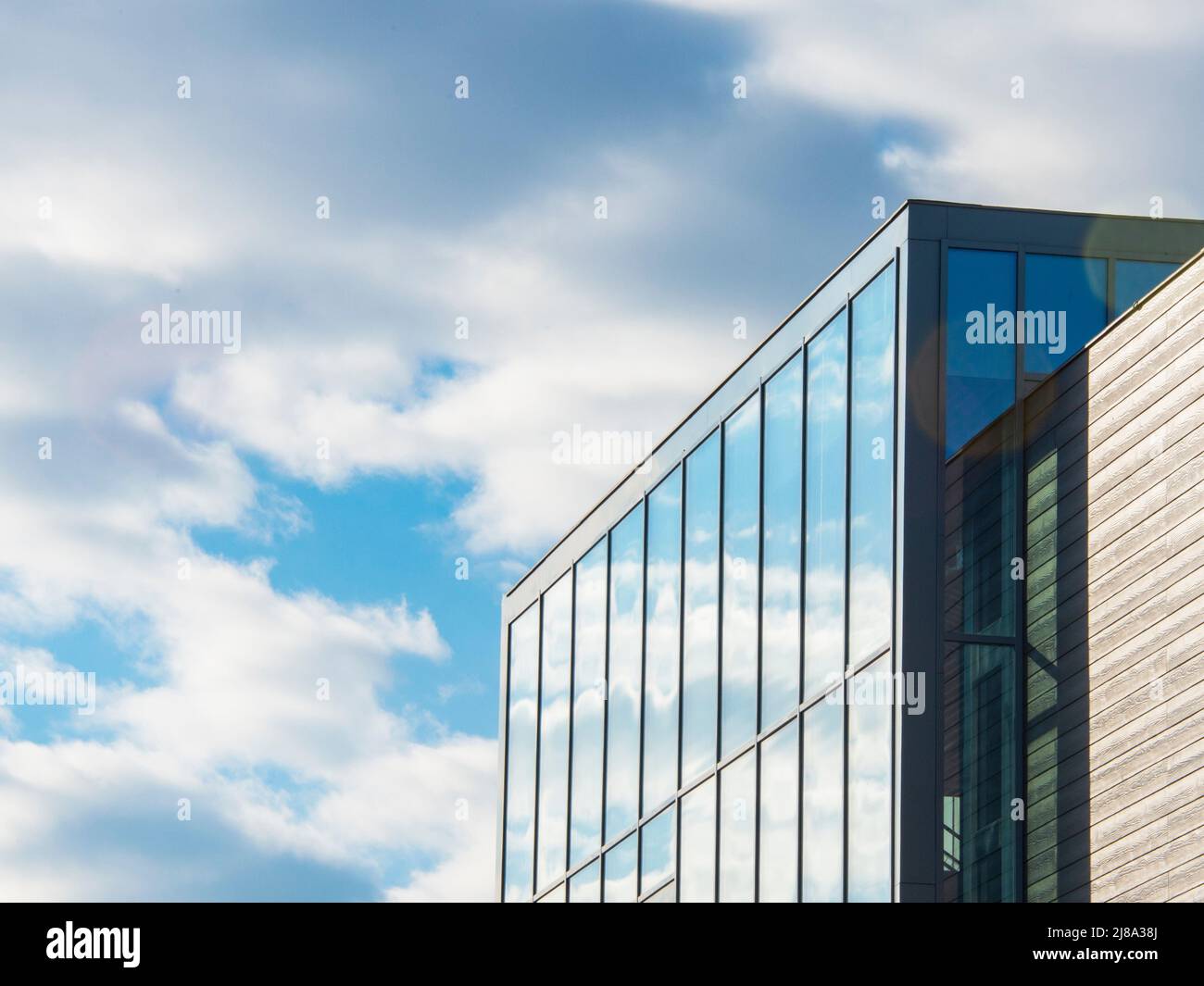 Glass building corner architecture on blue beautiful sky background ...