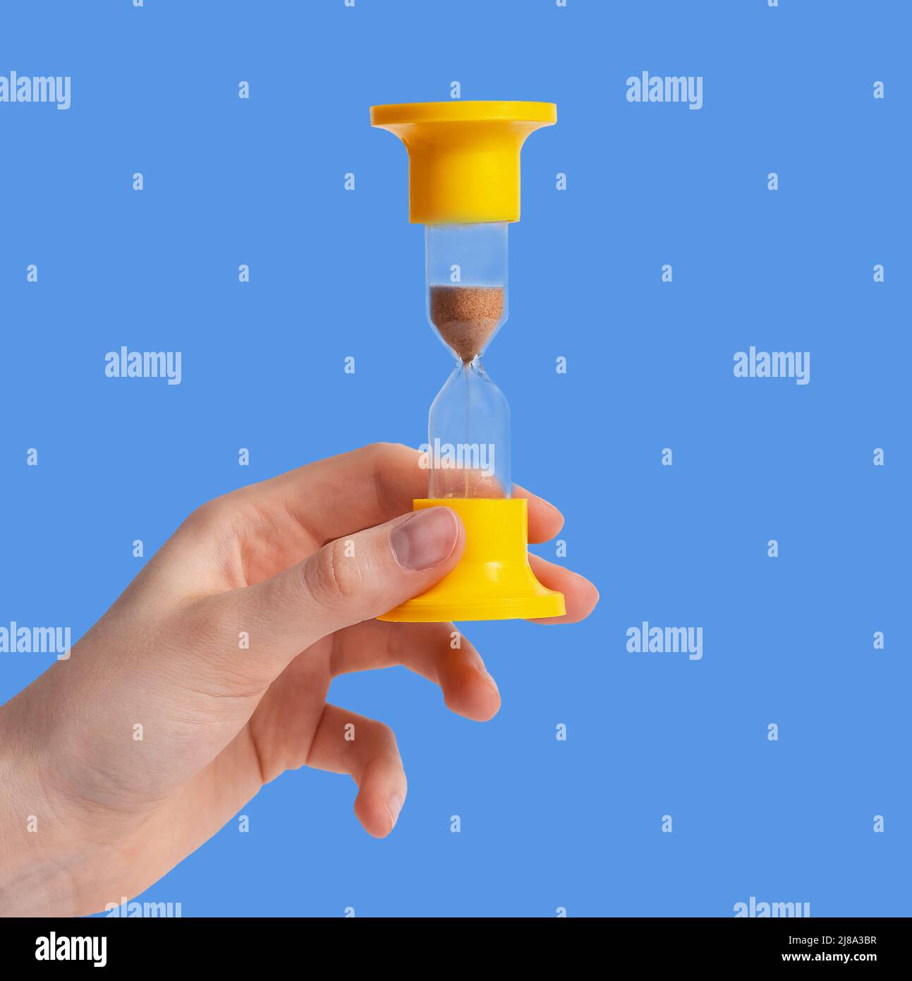 Holding sand timer hi-res stock photography and images - Alamy