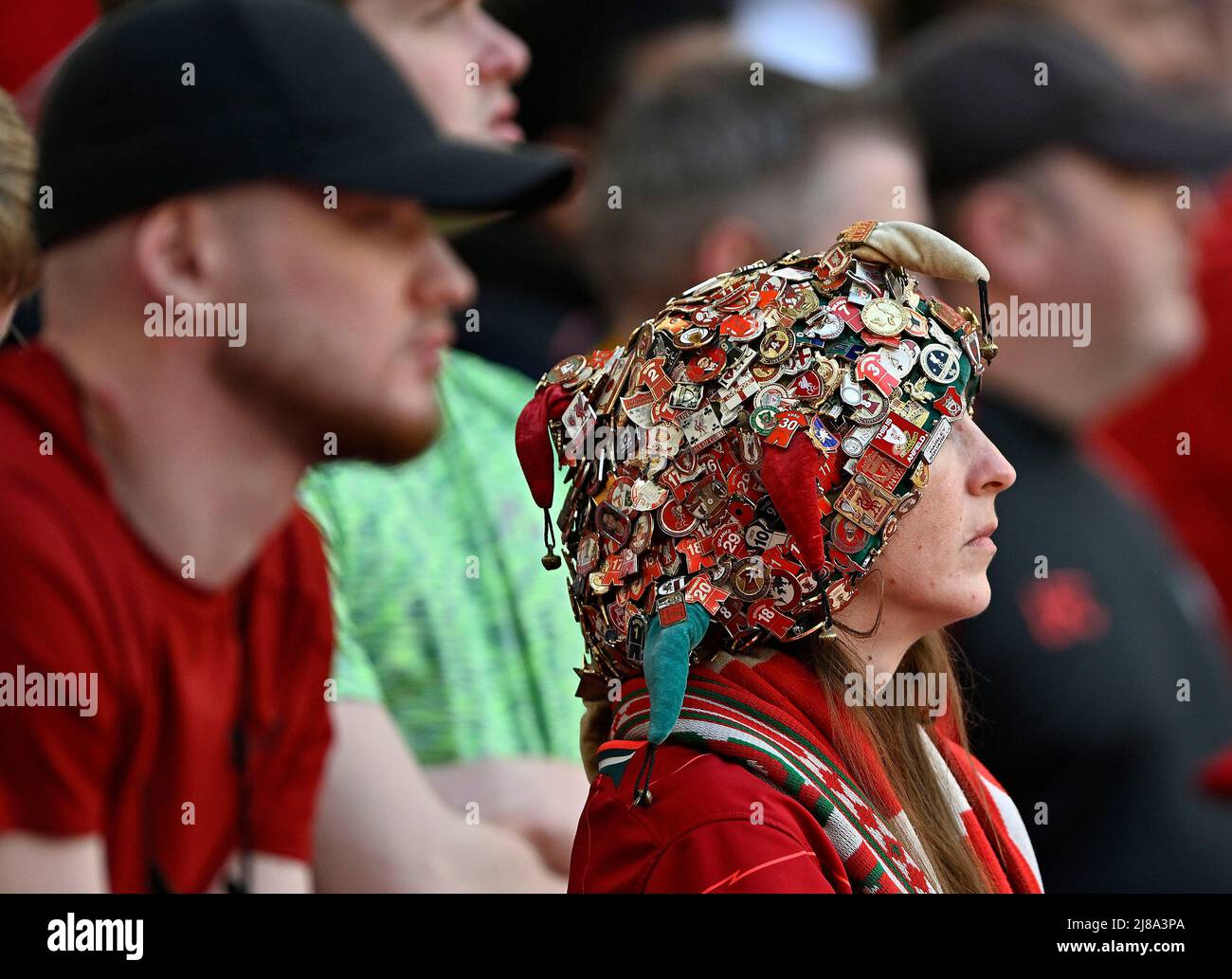 London, UK. 14th May, 2022. A Liverpool fan with a hat completely full ...