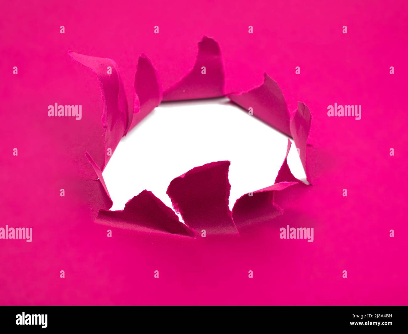 Pink crushed torn paper with hole copyspace background for idea Stock ...