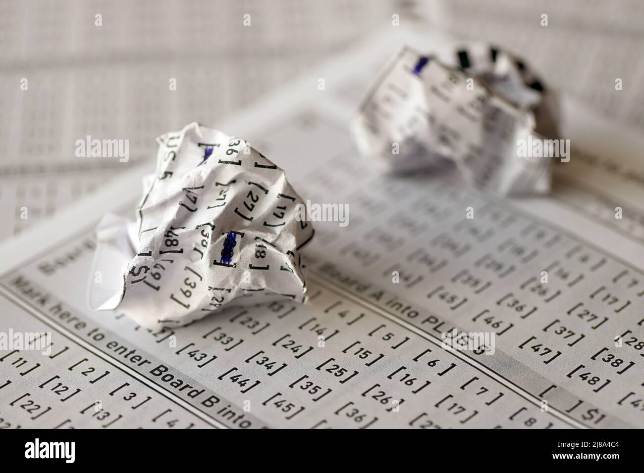 Crumpled lottery tickets as symbol of losing the lottery game. Unlucky ...