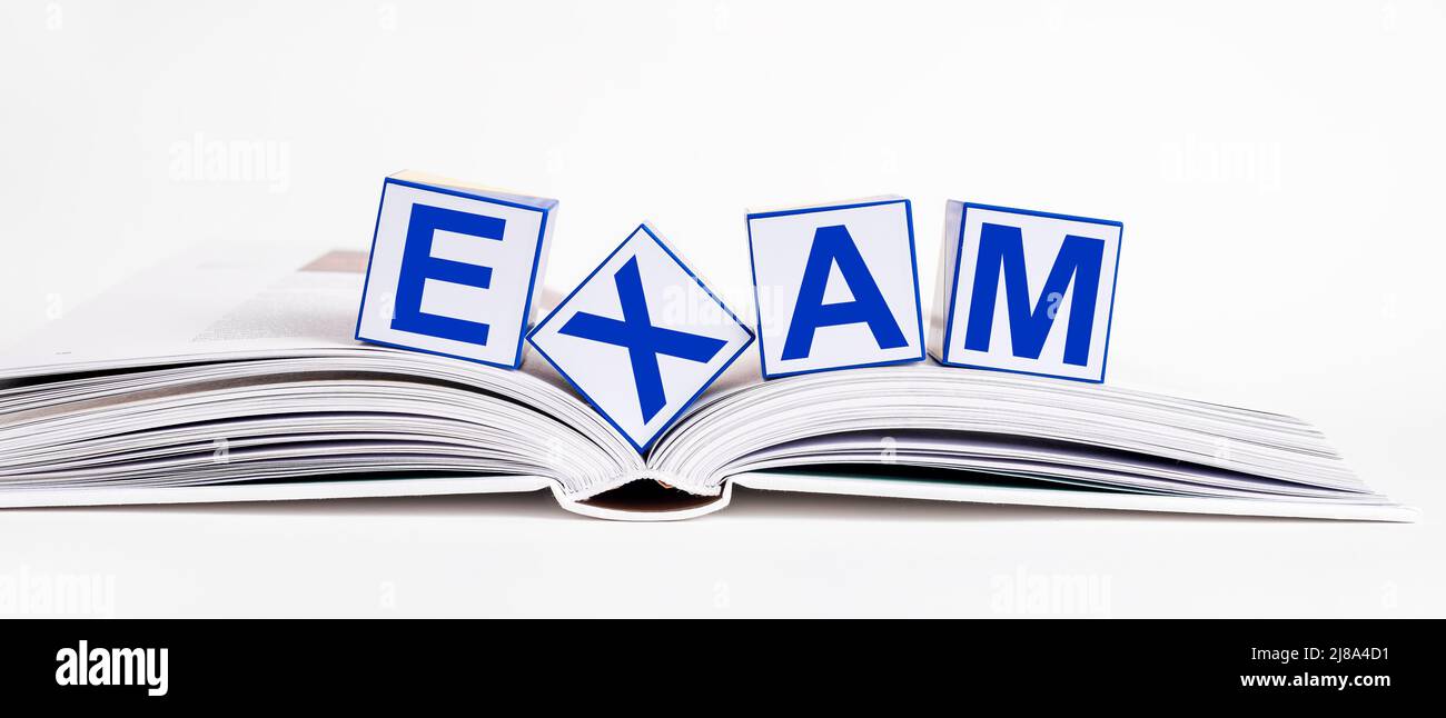 Exam, word on open book, textbook. High quality photo Stock Photo - Alamy
