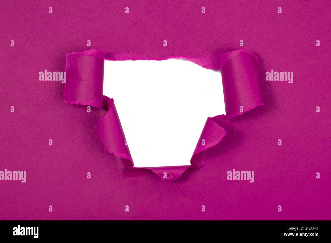 Pink crushed torn paper with hole copyspace background for idea Stock ...