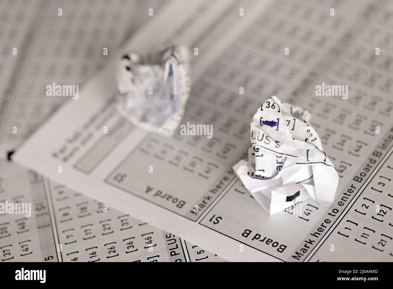 Crumpled lottery tickets as symbol of losing the lottery game. Unlucky ...