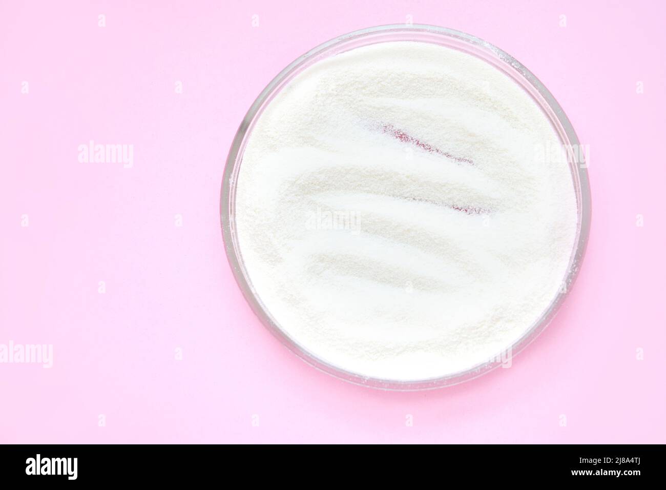 Collagen white powder. Pastel color background. Health product. Woman ...