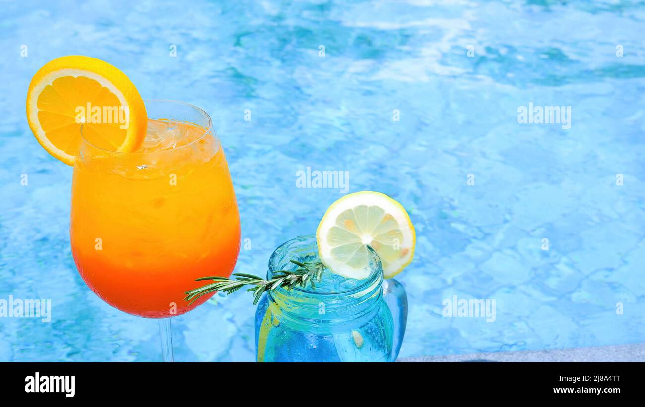 Poolside cocktails served cold at swimming pool bar, fresh summer ...