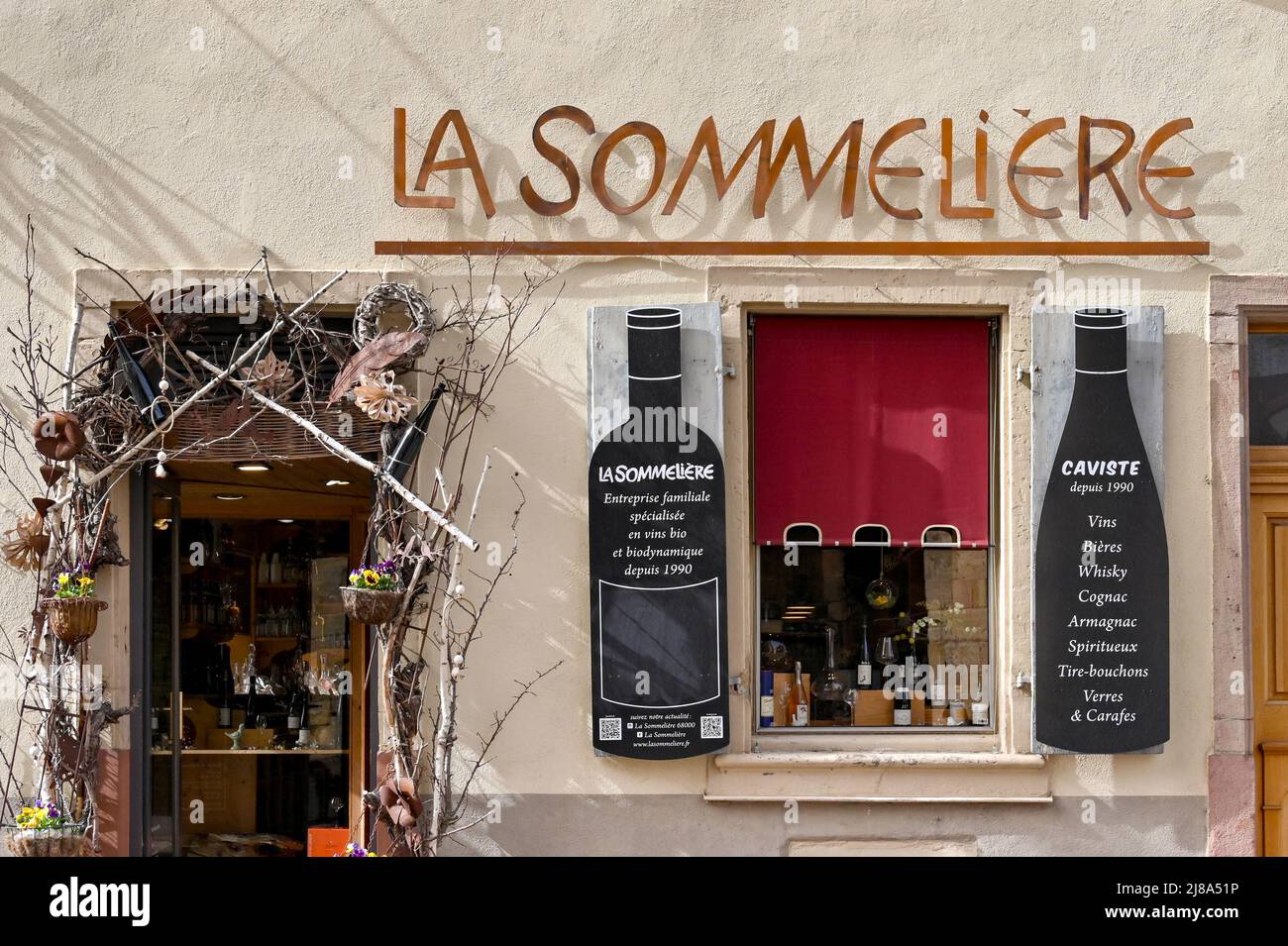 Colmar, France - April 2022: Front exterior view of a small wine shop ...