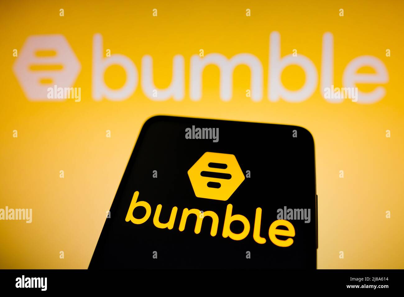In this photo illustration the Bumble logo seen displayed on a ...