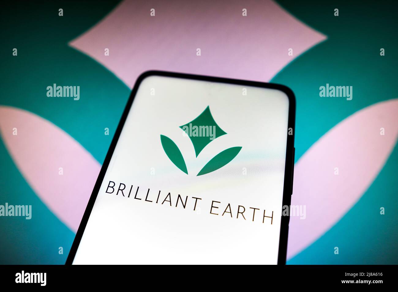 In this photo illustration the Brilliant Earth logo seen displayed on a ...