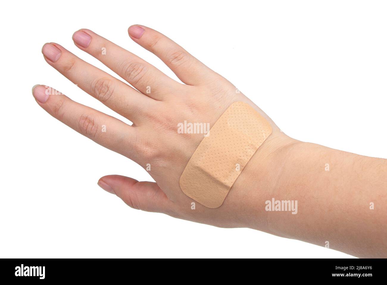 Medical big elastic plaster on woman hand isolated on the white ...