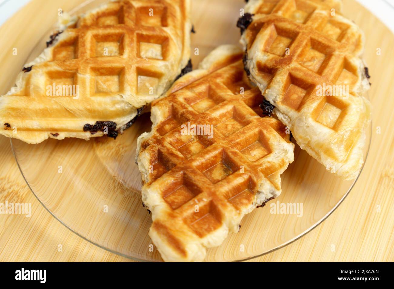 Croffles. Croissant dough is molded using a waffle mold. Flat lay Stock ...