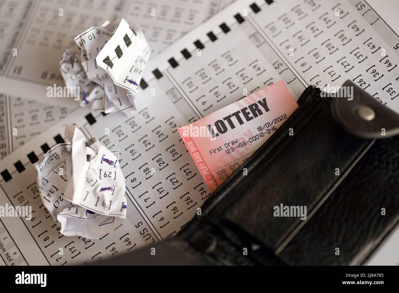 Crumpled lottery tickets and empty purse as symbol of losing the ...