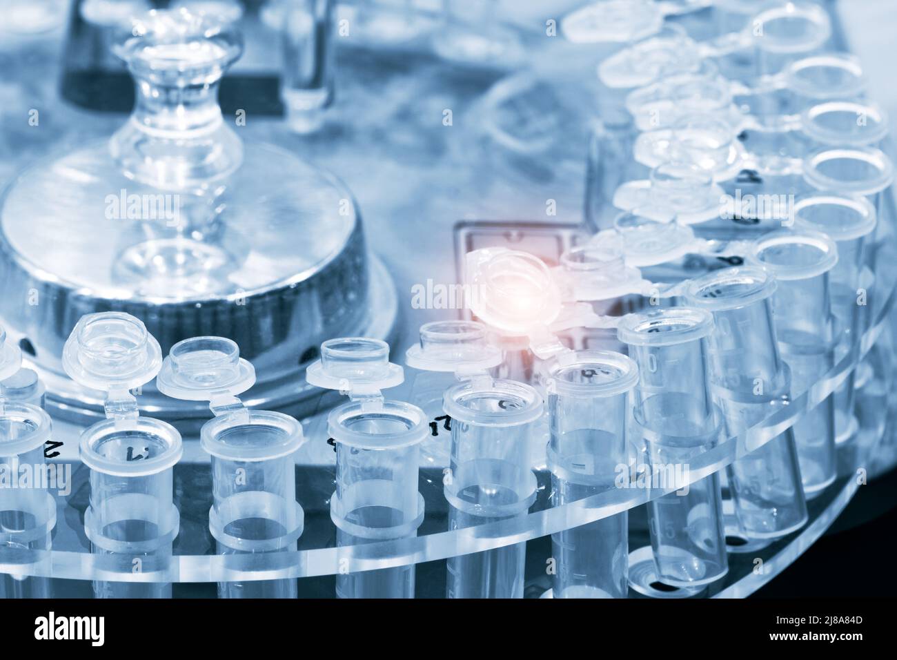 Medical or chemical background with laboratory equipment and liquids ...