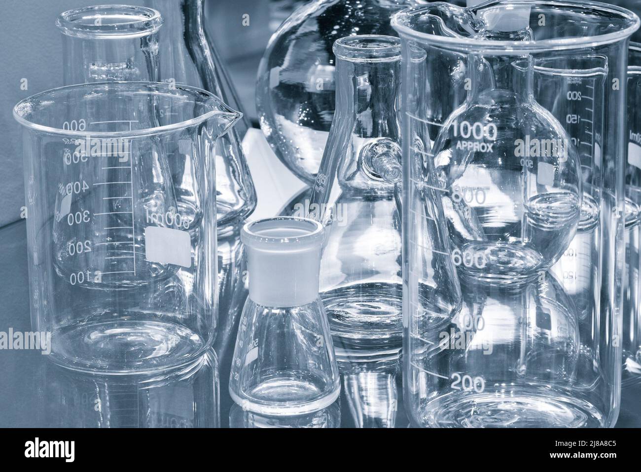 Medical or chemical background with laboratory equipment and liquids ...