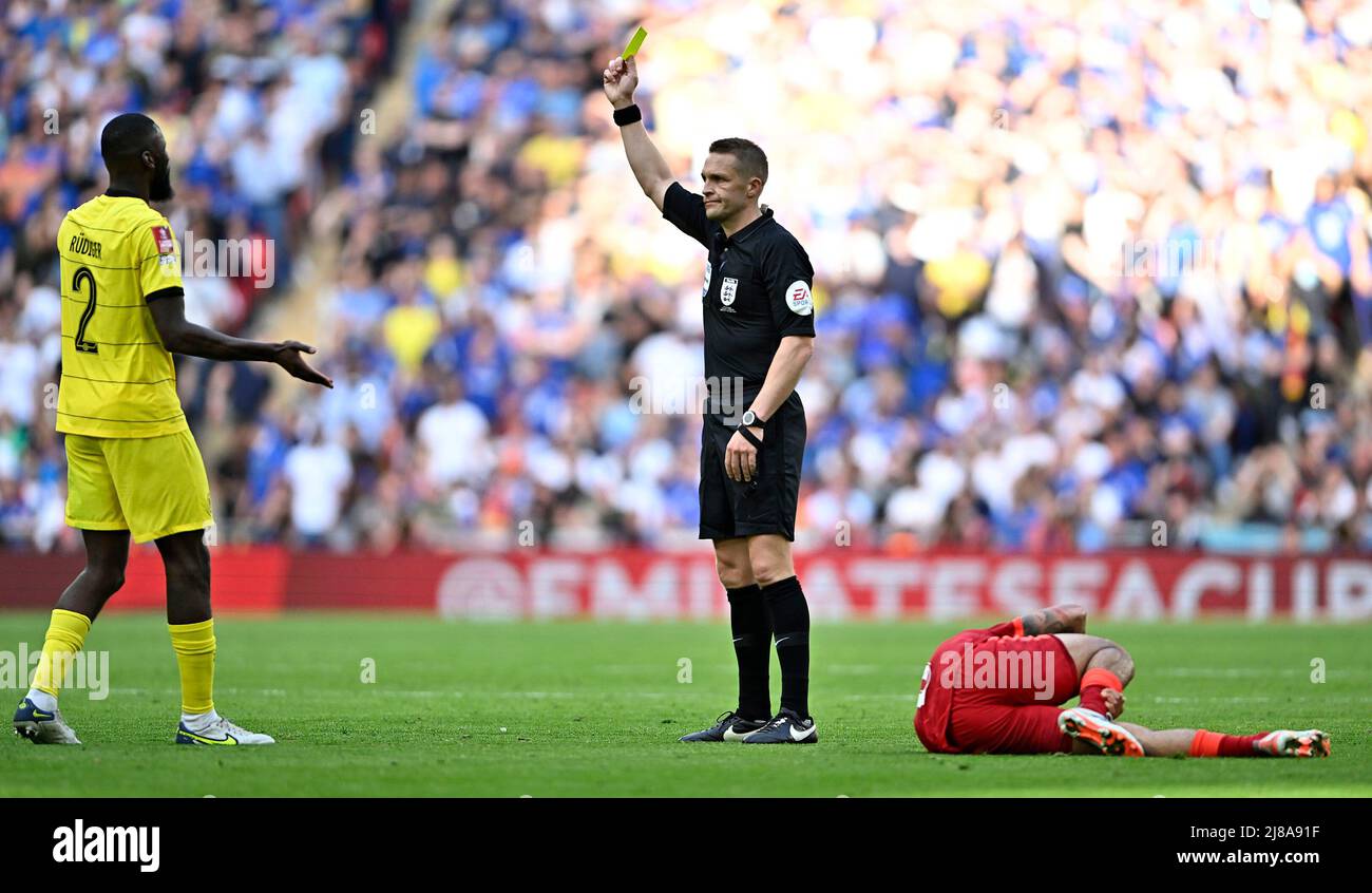 London, UK. 14th May, 2022. Craig Pawson (Referee) shows the yellow card to Reece James (Chelsea ...