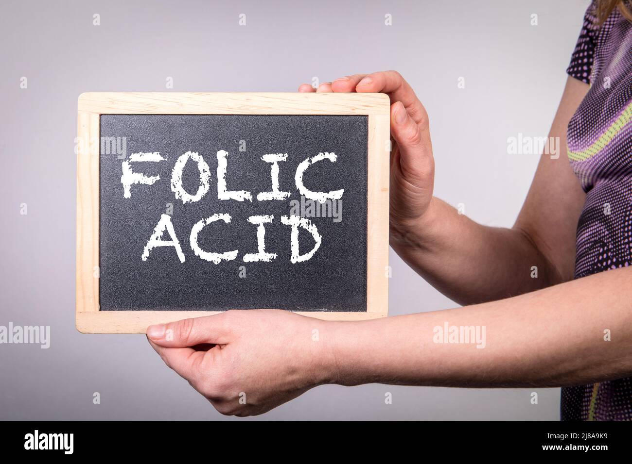 Doctor holding board word hi-res stock photography and images - Alamy