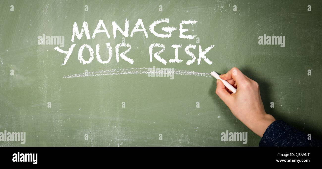 Manage Your Risk. Text on a green chalkboard Stock Photo - Alamy