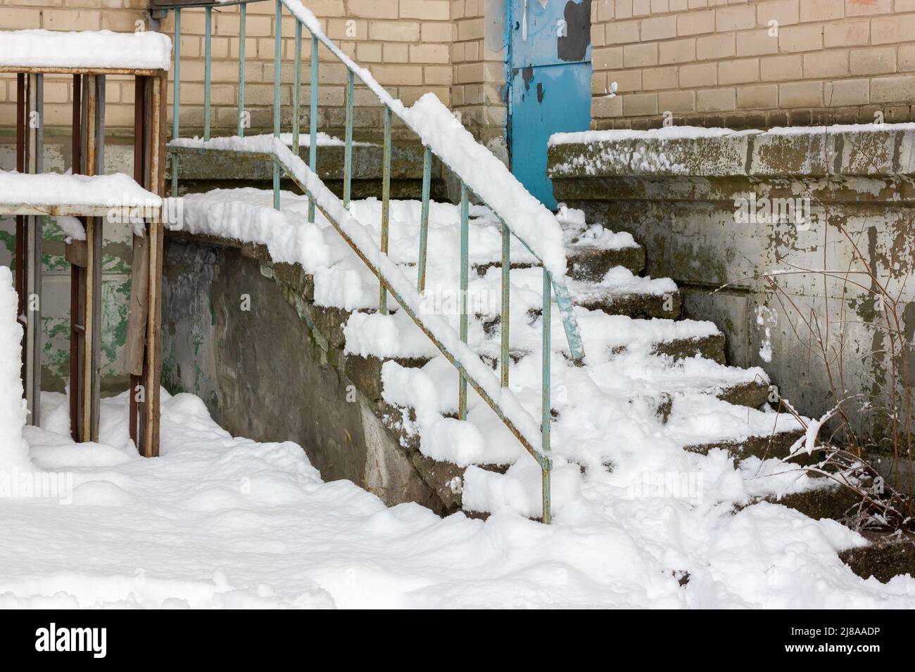 Old snow covered stairs. Iced entrance. Snowy weather Stock Photo - Alamy