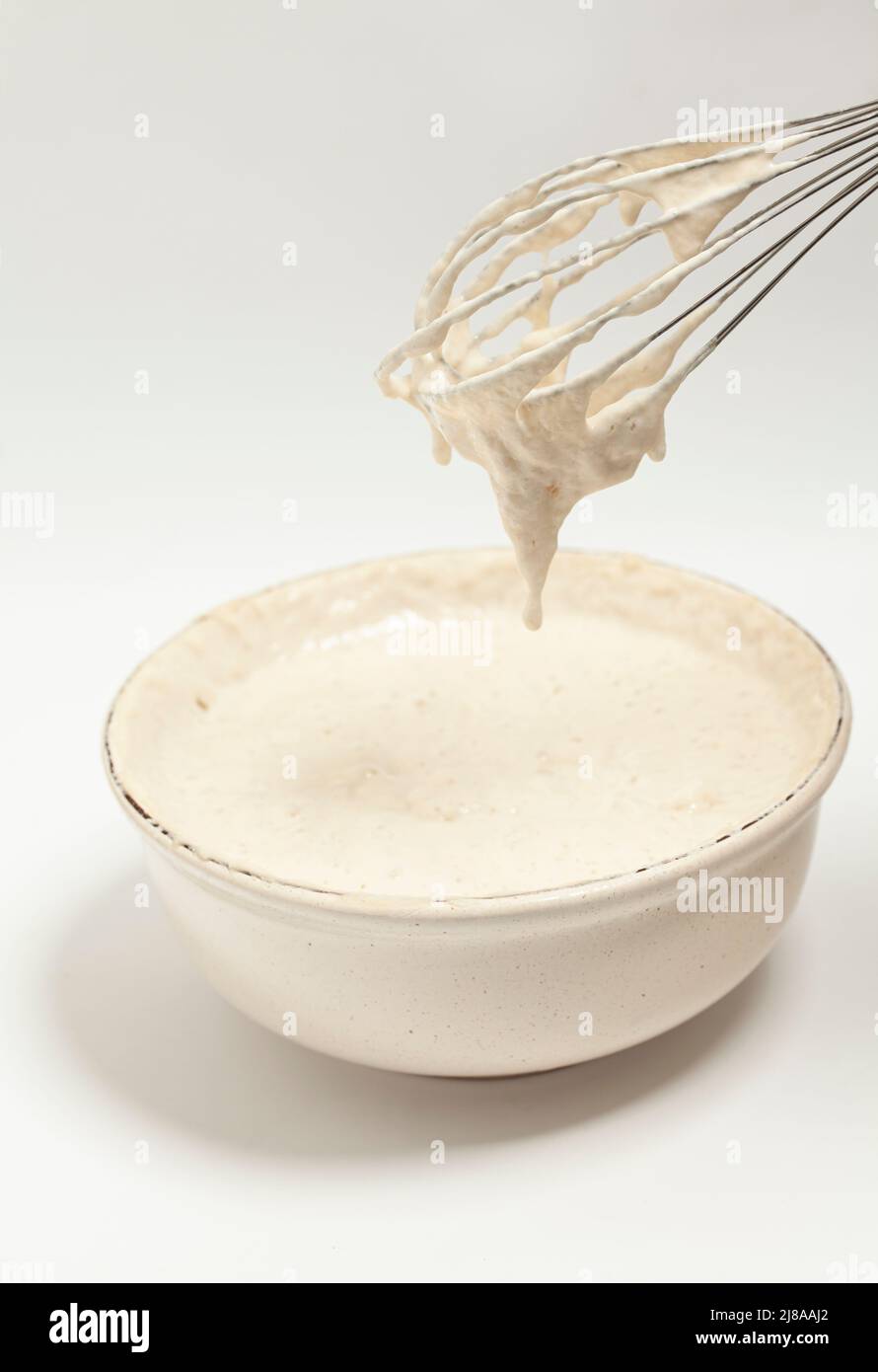 Mixing baking ingredients isolated on white background Stock Photo - Alamy