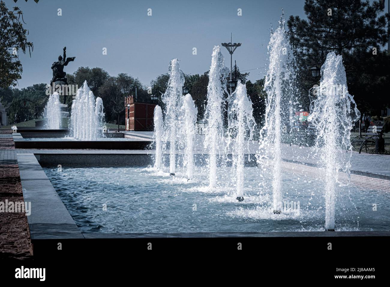 Fountain. View of the fountain in the public park. Photo processing in blue tone Stock Photo - Alamy