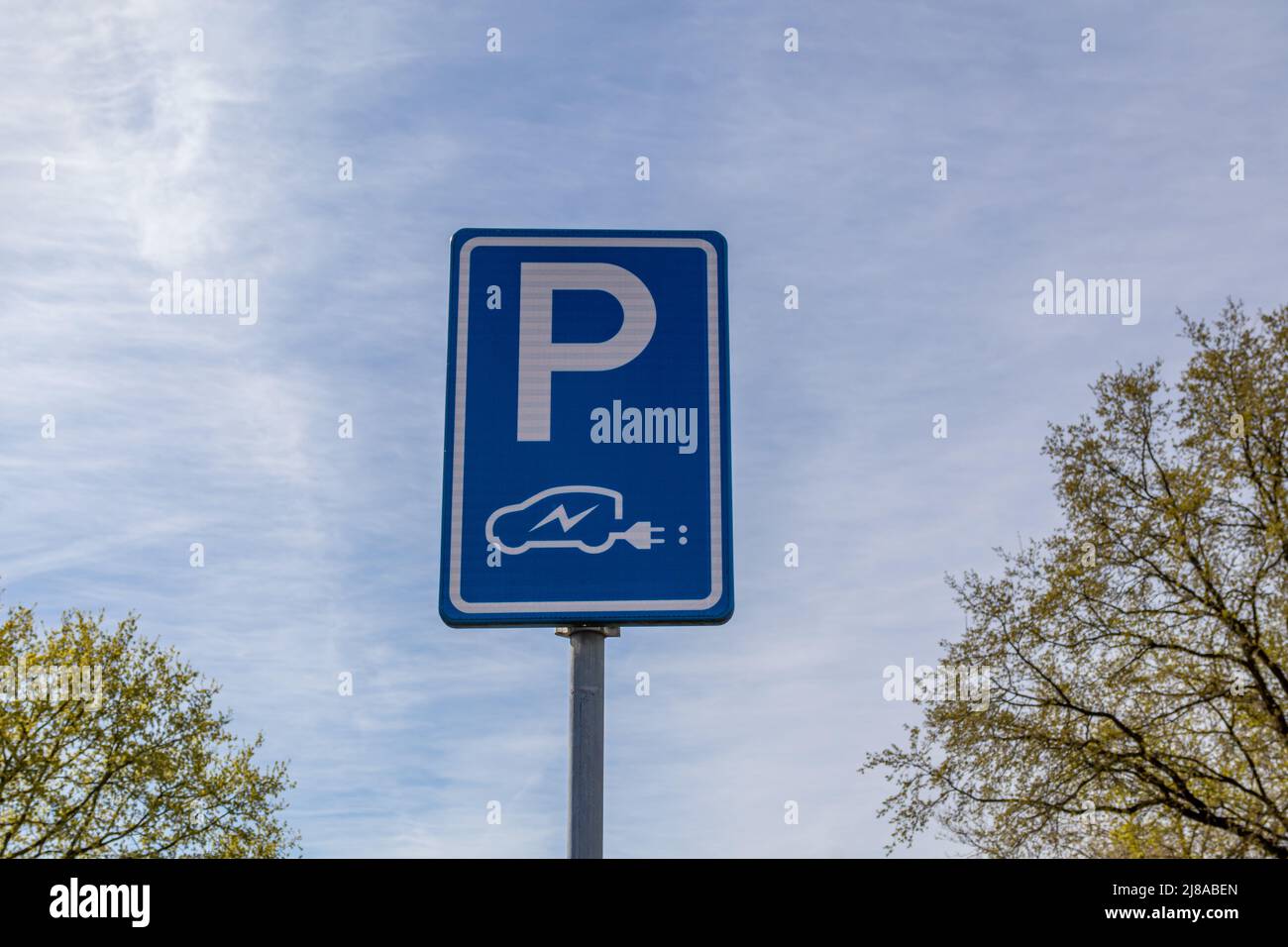 Parking sign and charging station for electric cars, blue plate with a ...