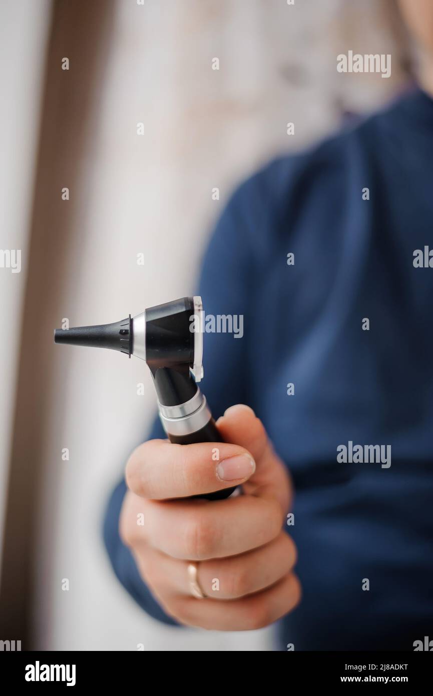 Checking doctor ear otoscope patient hi-res stock photography and ...