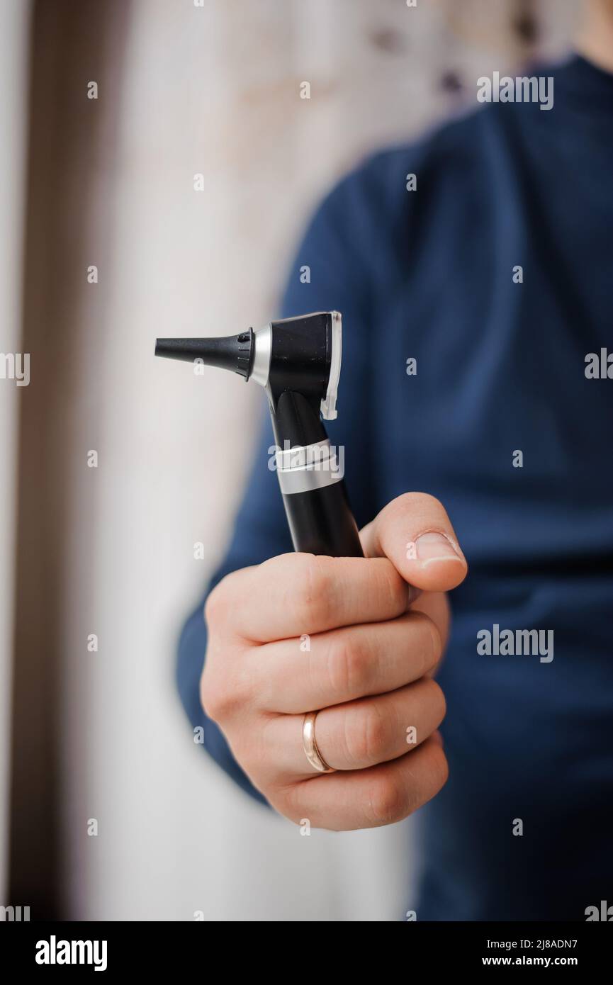 Checking doctor ear otoscope patient hi-res stock photography and ...