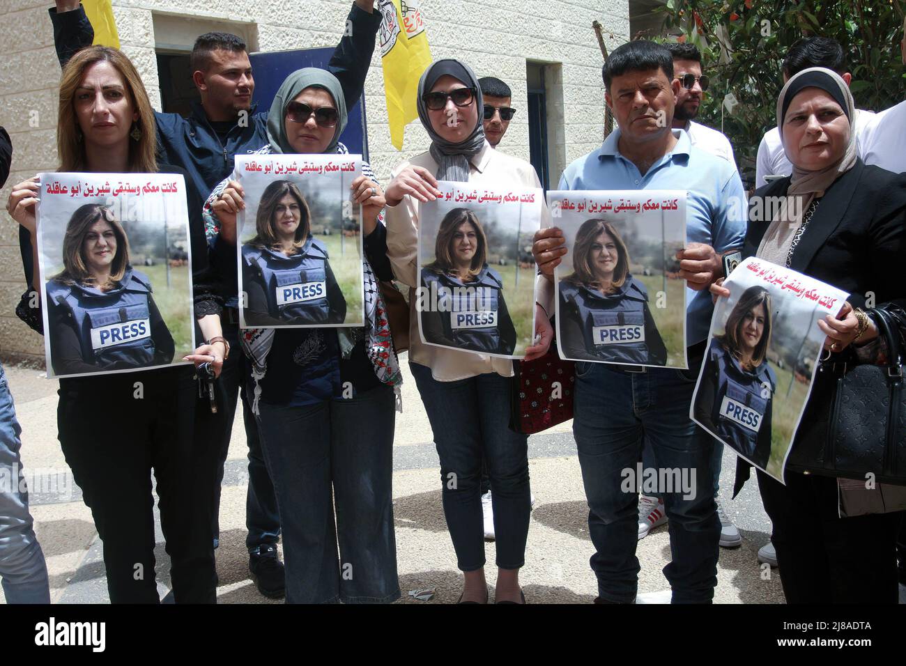 Nablus, Palestine. 15th May, 2022. Palestinian students hold pictures ...