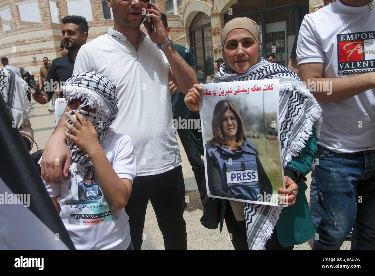 Nablus, Palestine. 15th May, 2022. A Palestinian student holds a ...