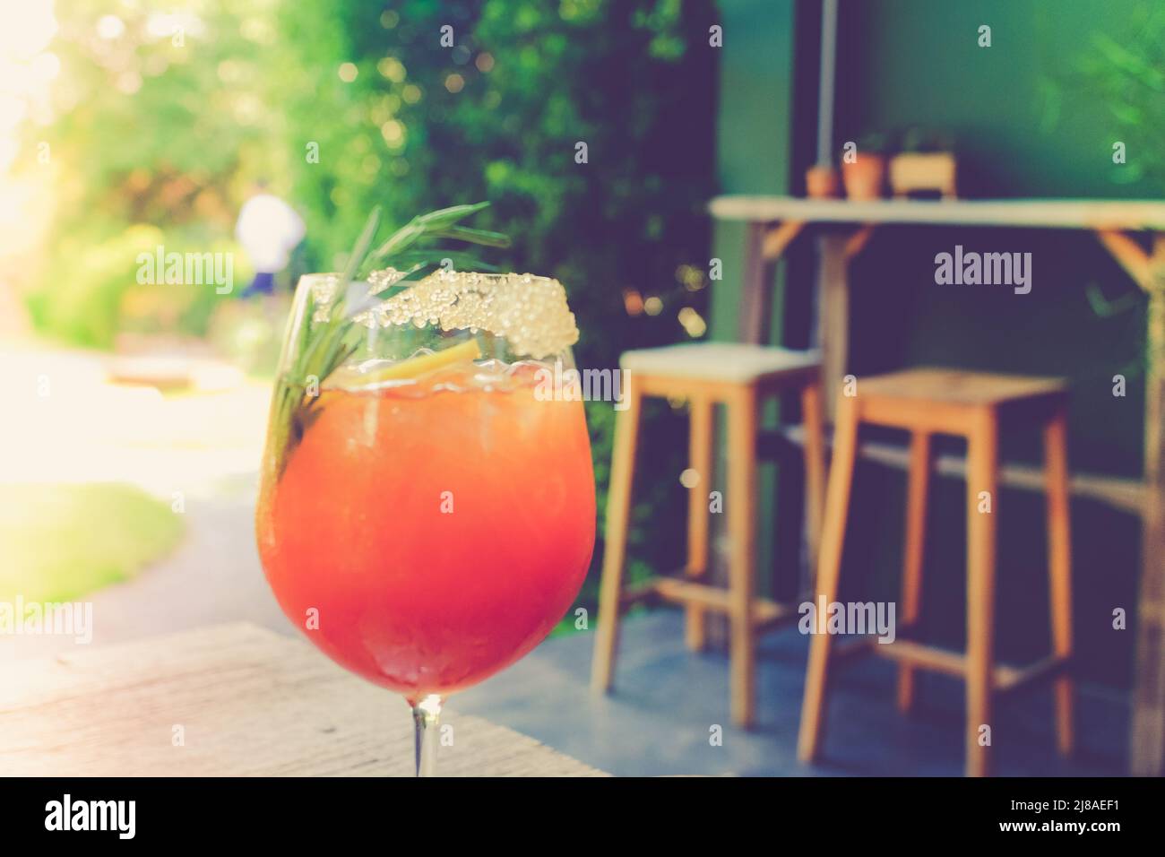 Fresh summer drink mocktail pour in glass on blur cafe bachground Stock ...