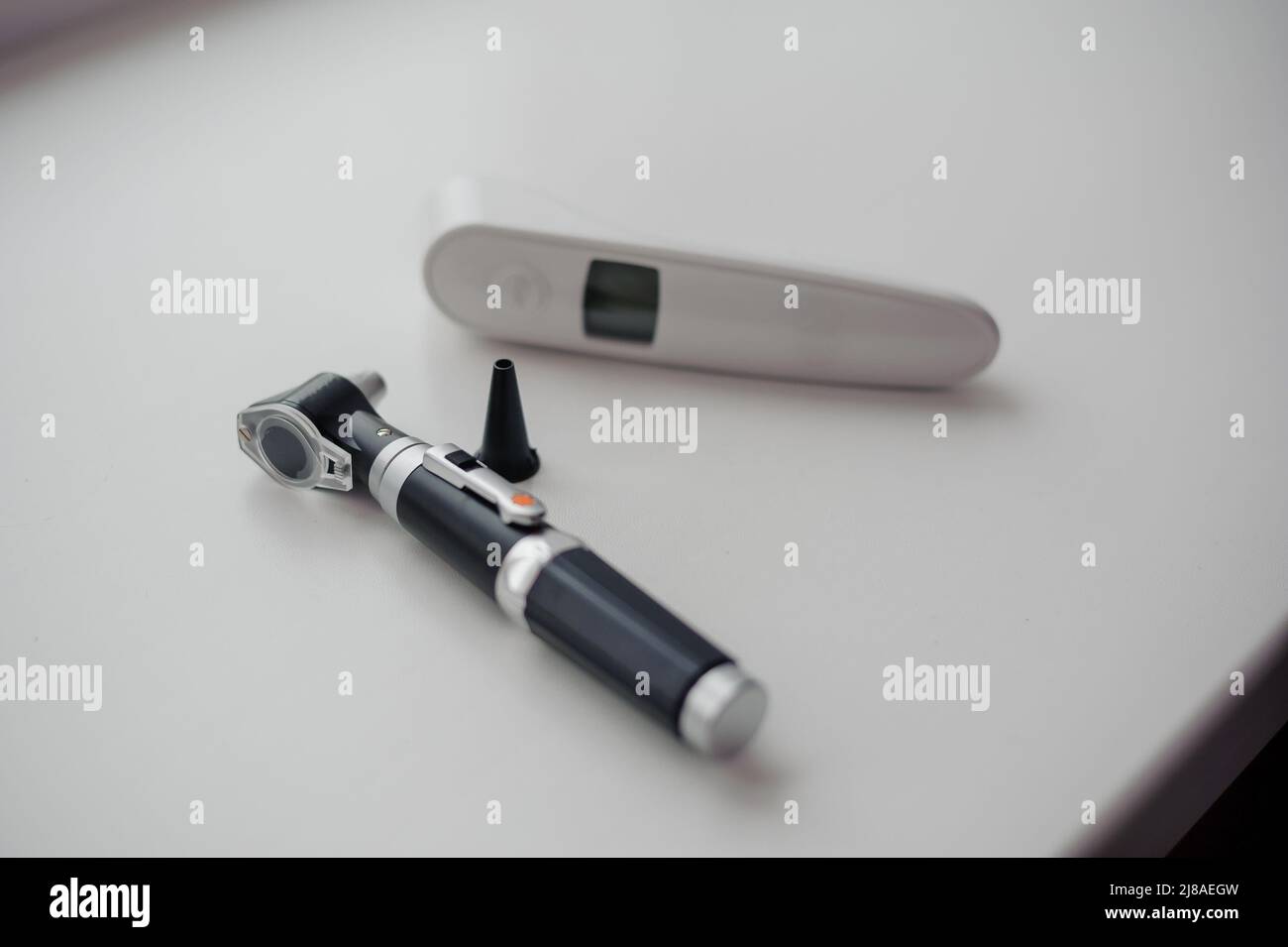 Non-contact thermometer on a white background for measuring body ...